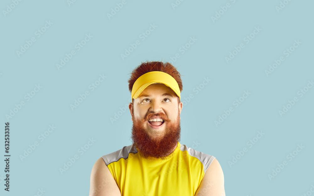 Funny happy goofy crazy bearded fat man in yellow sportswear and sun ...