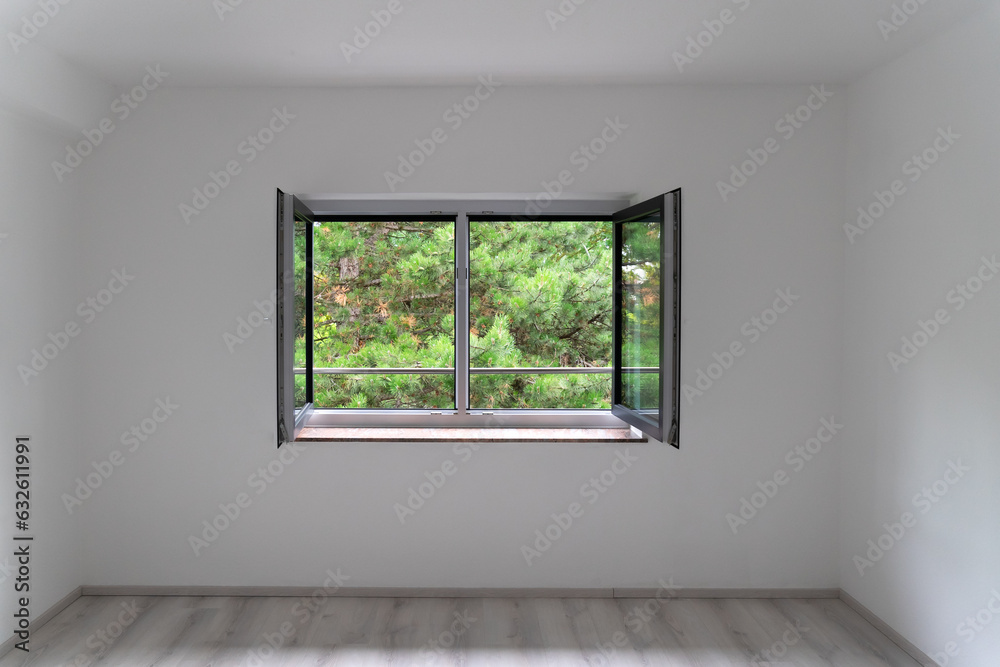 Empty white room with the window open wide to green. Ready for a new ...