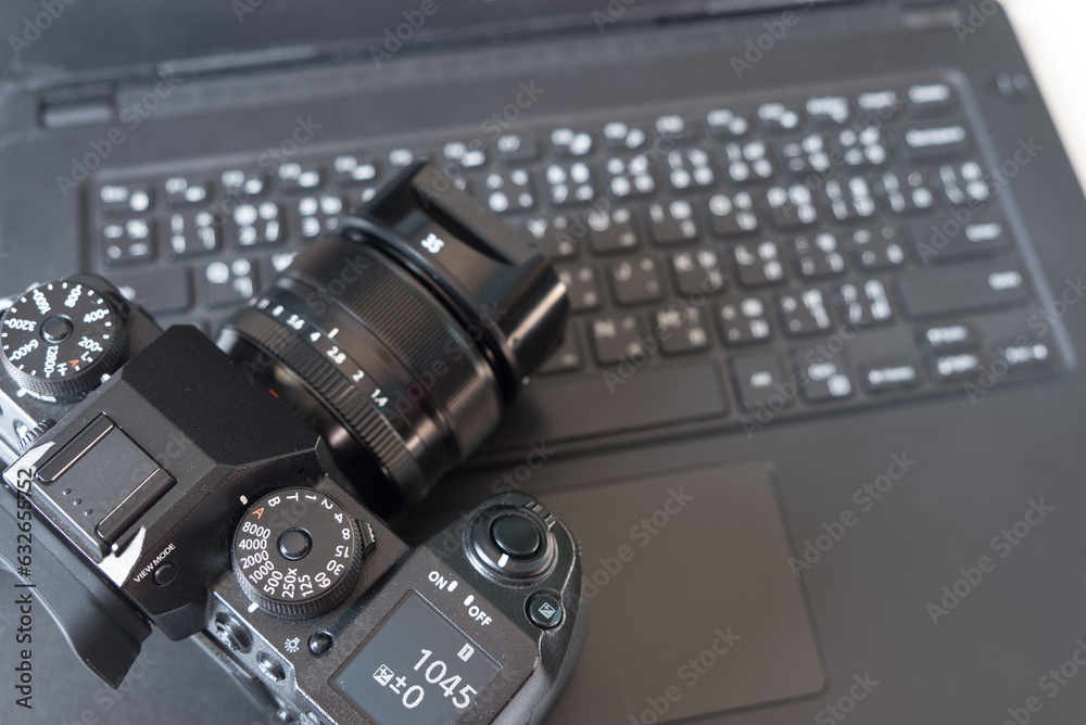 Camera lens and laptop computer of photographer for set create photo ...