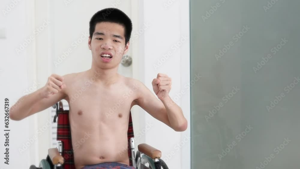 Teenager boy exercise muscles of arms and shoulders to joint movement ...