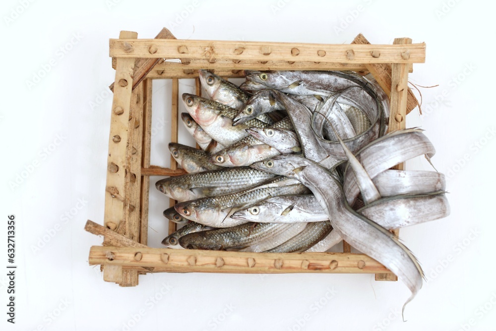 Wooden box with fresh sea fish, seafood, white wooden table, top view ...