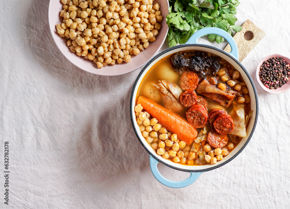 Cocido Madrileño, a traditional Spanish meal, chickpea-based stew from ...