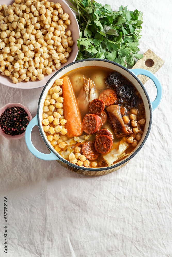 Cocido Madrileño, a traditional Spanish meal, chickpea-based stew from ...