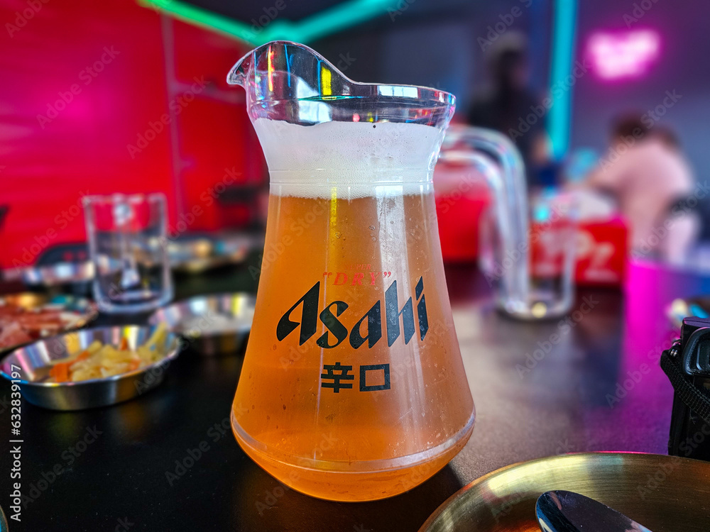 Asahi beer jar, Asahi beer mug with foam on table with light and ...