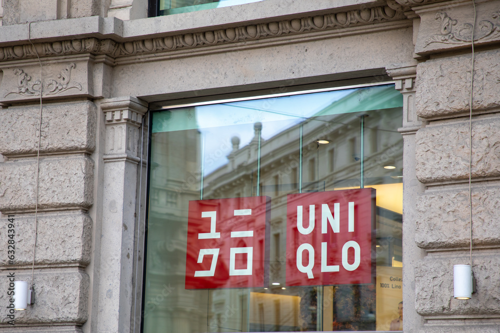 Uniqlo logo sign and brand text chain window store clothes shop front ...