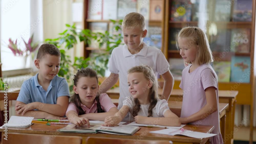 5 primary school students enjoy learning together. Team work. Students ...