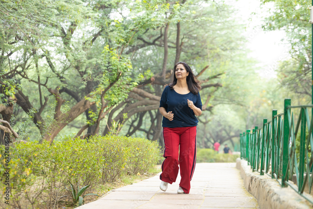 Indian woman doing jogging at park. Stock Photo | Adobe Stock