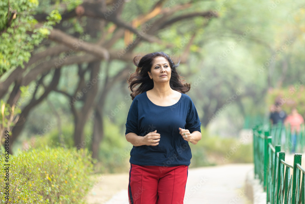 Indian woman doing jogging at park. Stock Photo | Adobe Stock