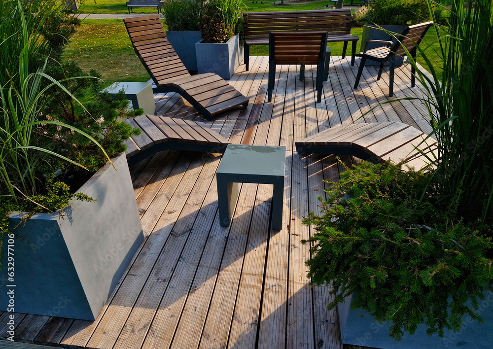 rocking chair pavement under trees in square. wooden deck chairs made ...
