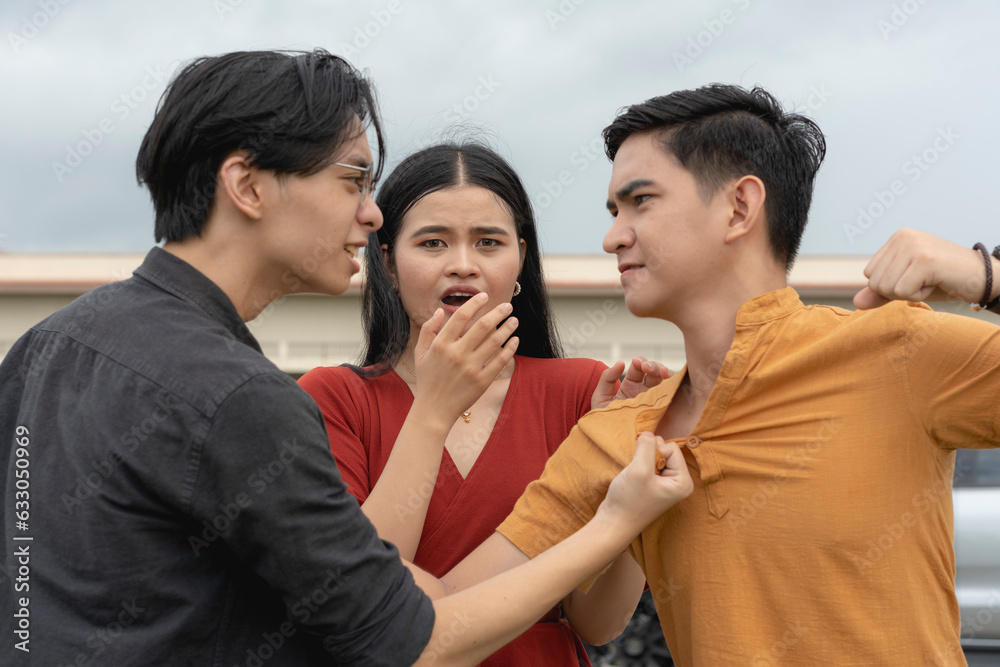 A nervous and shocked woman gasps while in the middle of two men fighting over her love and ...