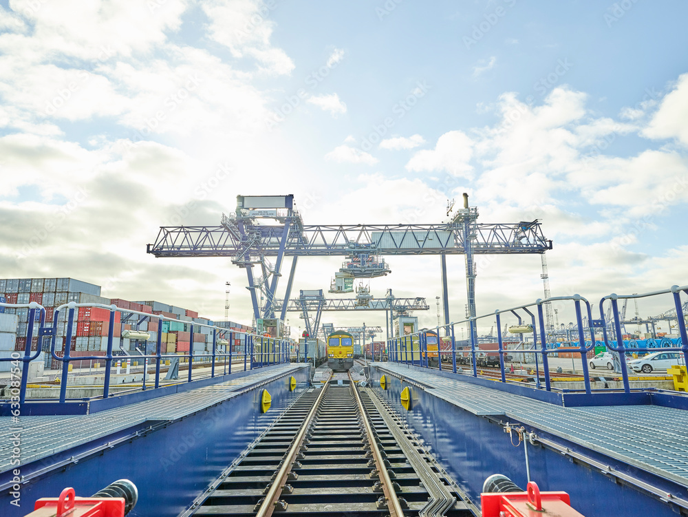 Railway dockyard with train and cargo crane, Felixstowe, England. Stock ...