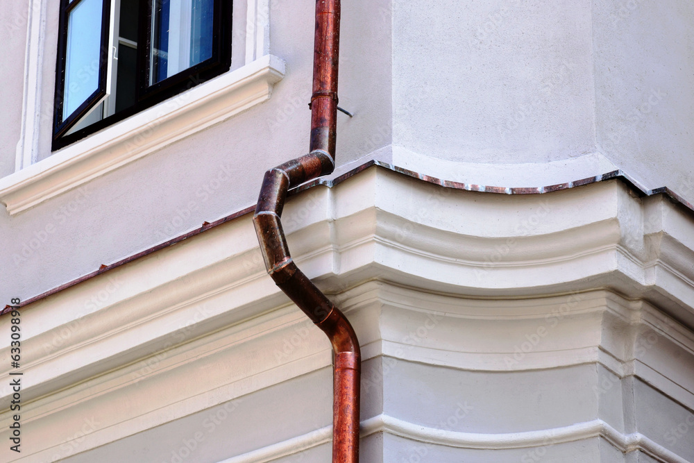 shiny new copper rain water leader, downspout or down pipe detail ...