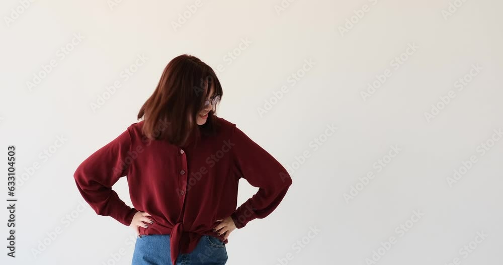Anxious Caucasian teenage girl standing on a plain white background ...