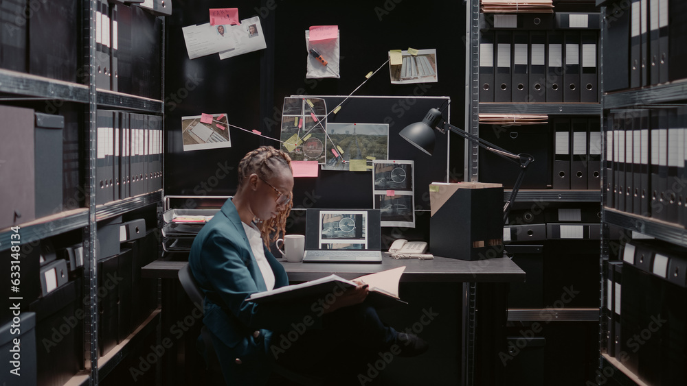 Private investigator reviewing new case evidence on detective board ...