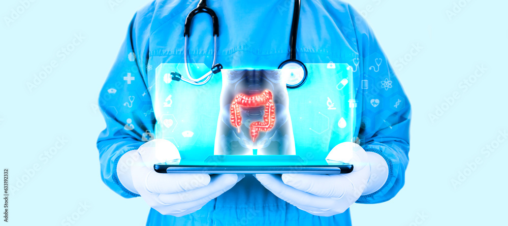 Doctor projects the human large intestine on the tablet. Study and ...