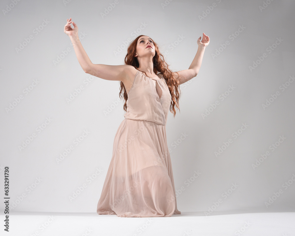 Full length portrait of beautiful brunette model wearing a pink dress ...