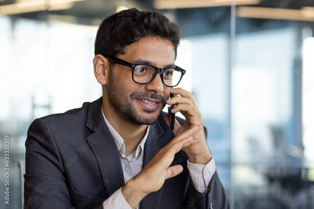 Young successful arab businessman boss talking on phone close up, man ... Young successful arab businessman boss talking on phone close up, man ...