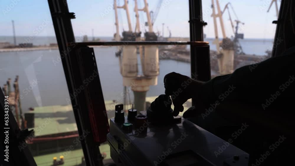 Man hands control joysticks at grain terminal operator cabin workplace ...