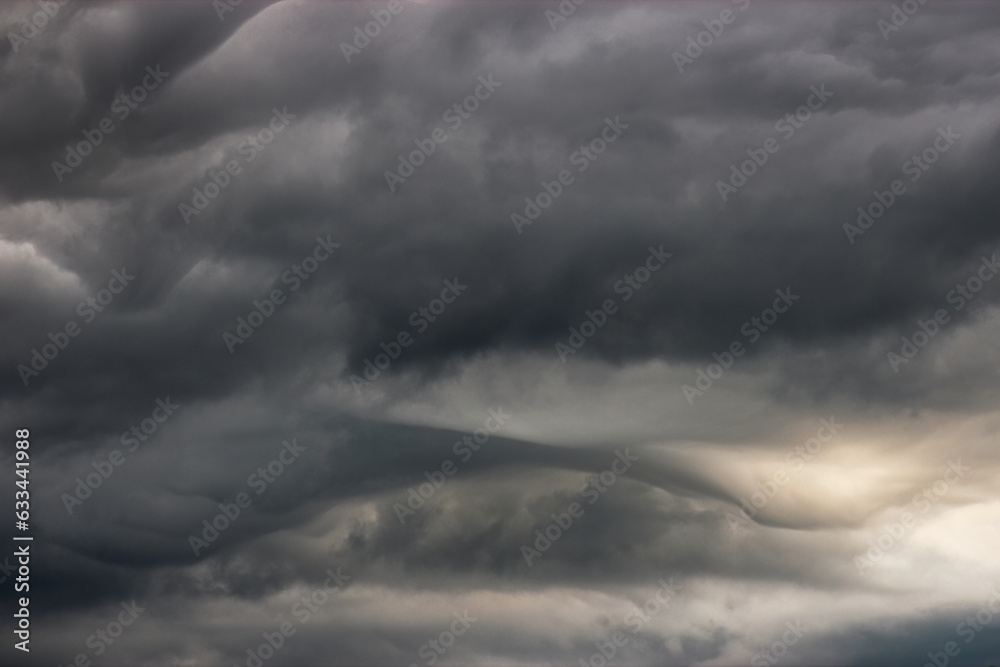 Dark clouds in the sky during a storm. The clouds are ominous and ...