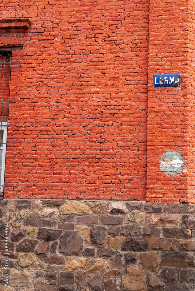 Photograph of red brick corner with stone plinth. 20th century English ...