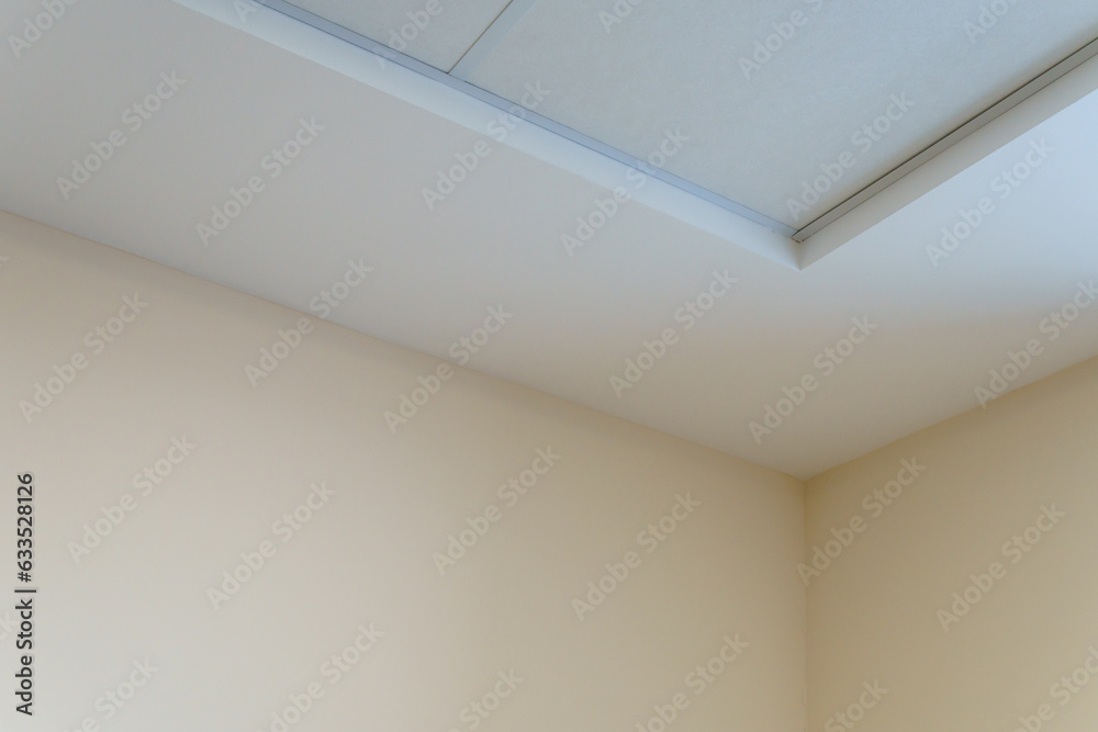 Parts of the ceiling decor in the corner, suspended ceiling made of ...