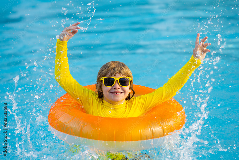 Boy swims in pool with float. Swimming, summer vacation. Child swim in ...