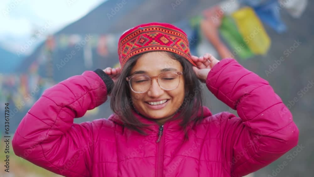 Portrait of beautiful smiling Indian girl wearing Himachali Cap ...