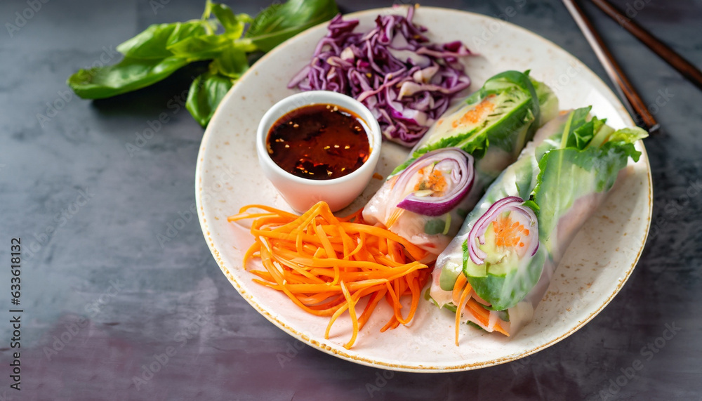 Vegetarian vietnamese spring rolls with spicy sauce, carrot, cucumber ...