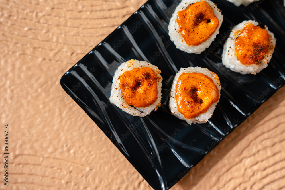 sushi is a Japanese dish of prepared vinegared rice, usually with some ...