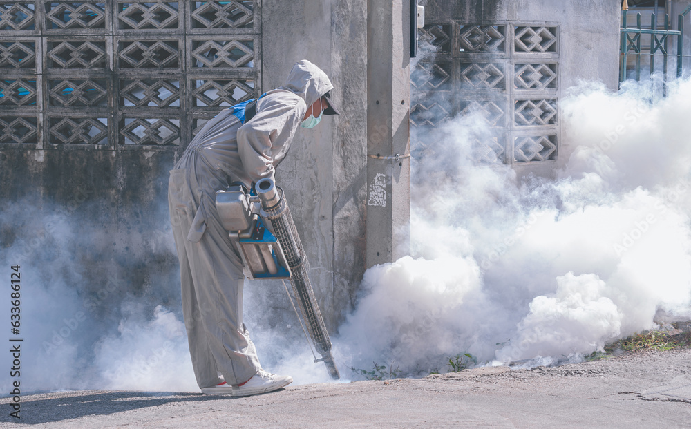 Healthcare worker using fogging machine spraying chemical to eliminate ...