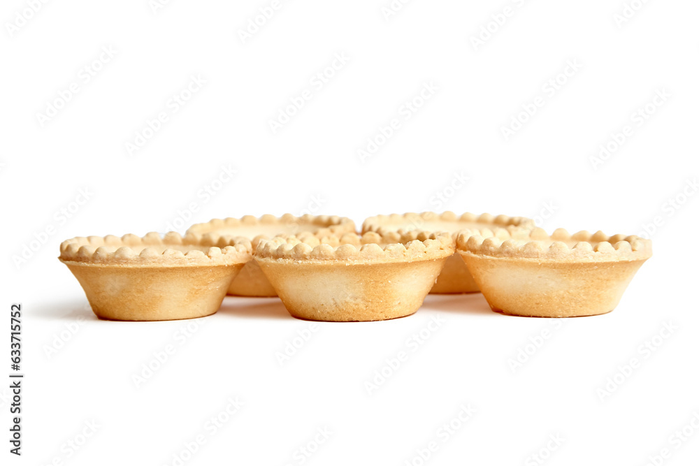 Unfilled tartlet shells isolated on white background. Five crispy mini ...