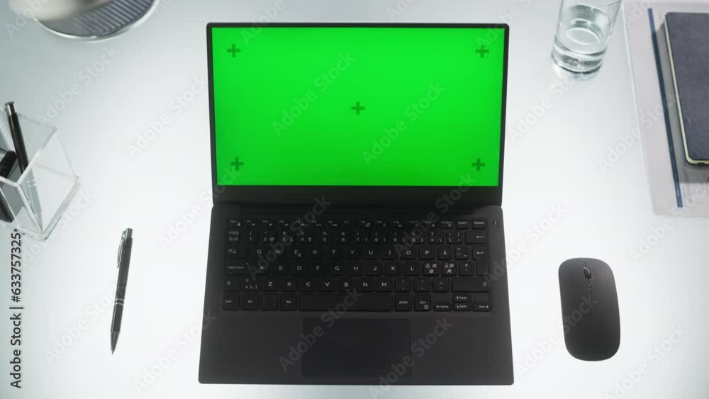 Top Zoom Out View of a Laptop Computer with Mock Up Green Screen ...