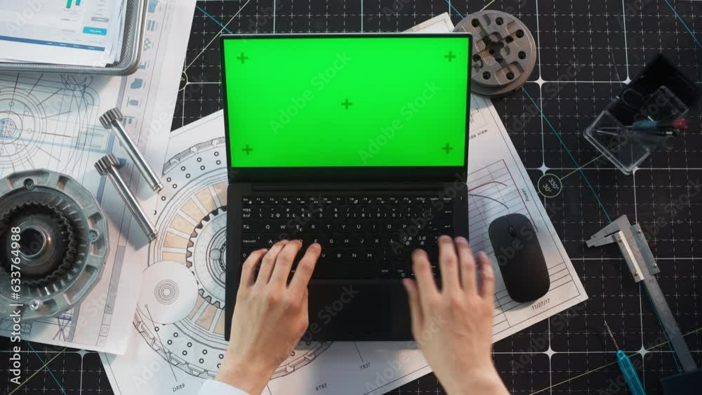 Anonymous Engineer Typing on a Laptop Computer with Mock Up Green ...