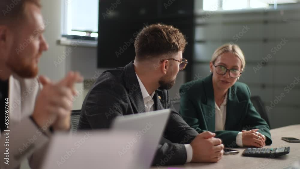 Positive male and female colleagues employees in suit cooperating in ...