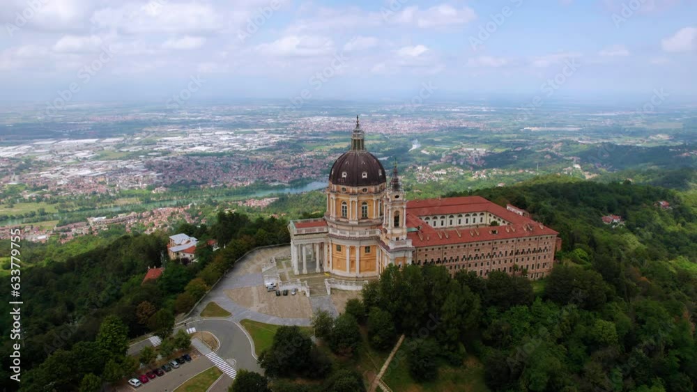 The drone aerial footage of the famous white orange Basilica of Superga ...