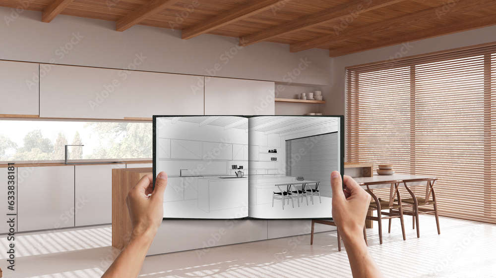 Hands holding notepad with kitchen design blueprint sketch or drawing ...
