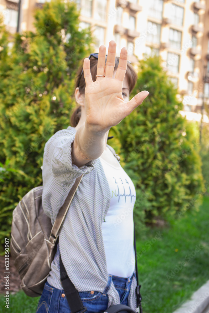 Woman showing gesture stop. Warning gesture. Domestic abuse concept ...