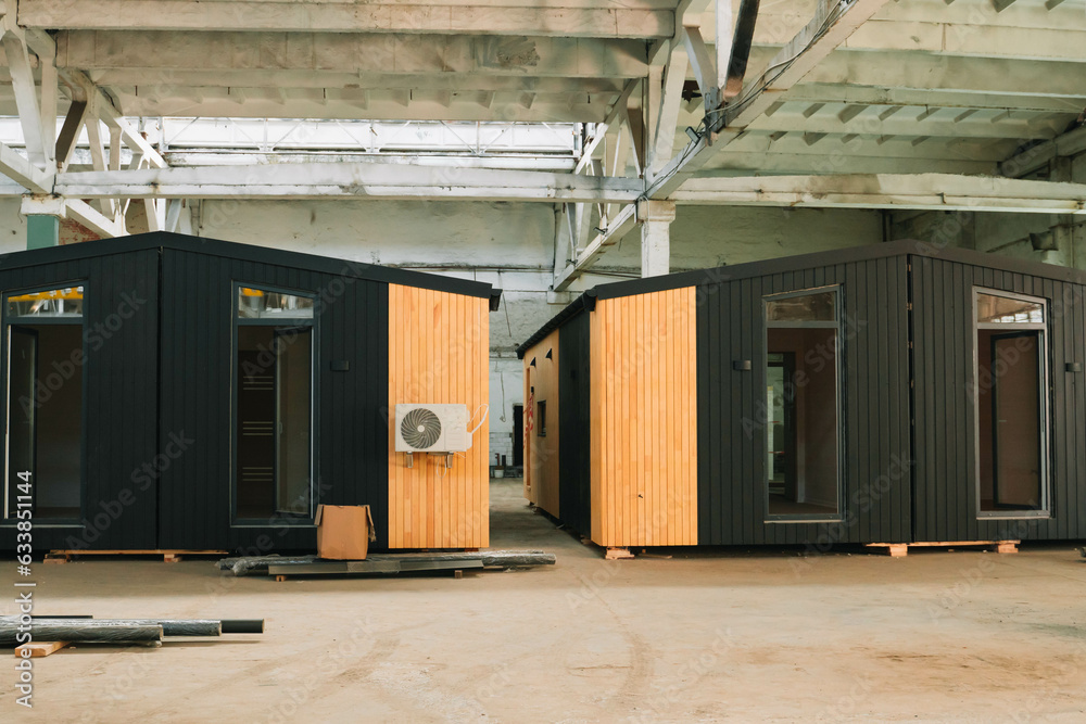 A new wooden modular prefabricated house inside an industrial building ...