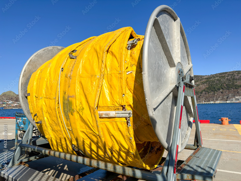 An industrial reel of orange oil sorbents spills containment boom ...