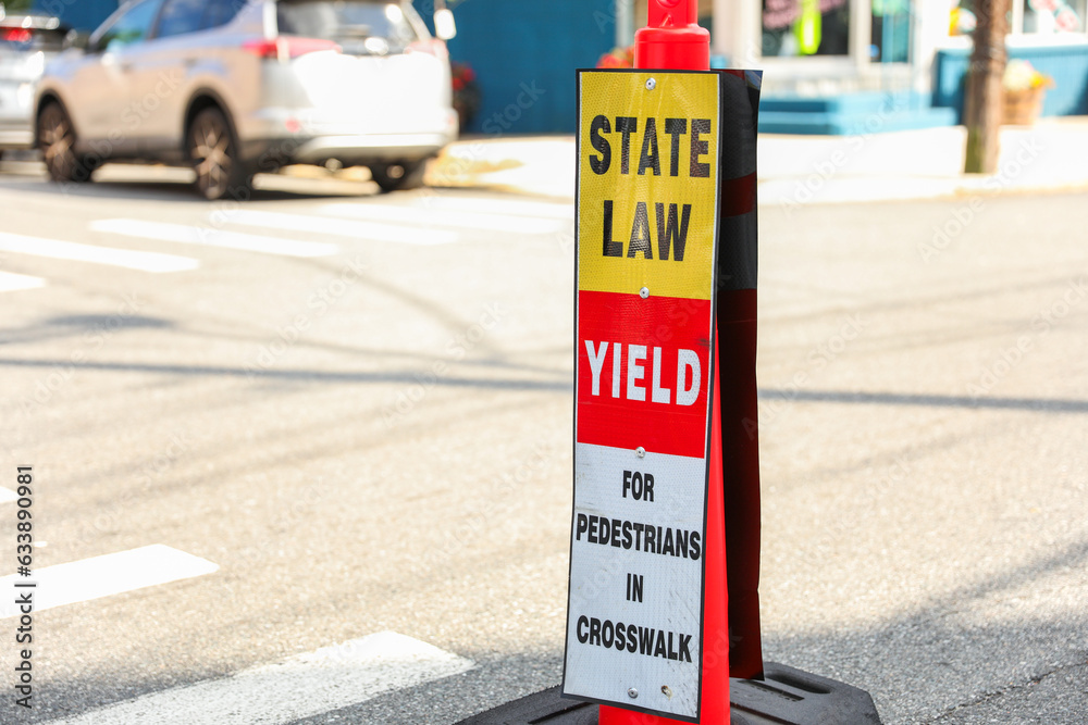 yellow pedestrian sign, a universal symbol of safety and shared space ...