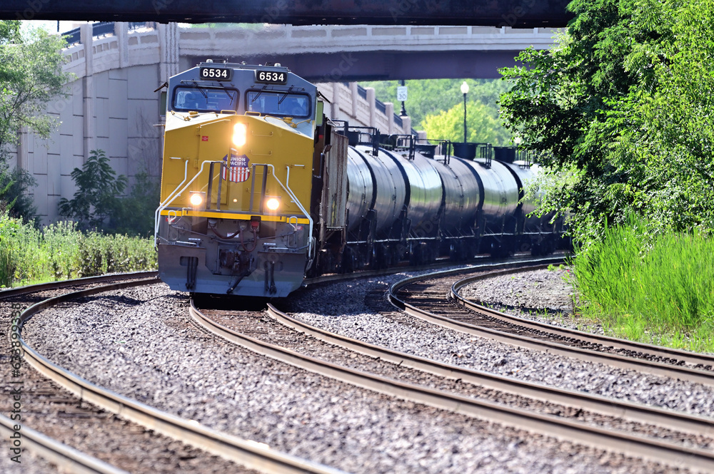 Two locomotives, with a required buffer car, lead a Union Pacific ...