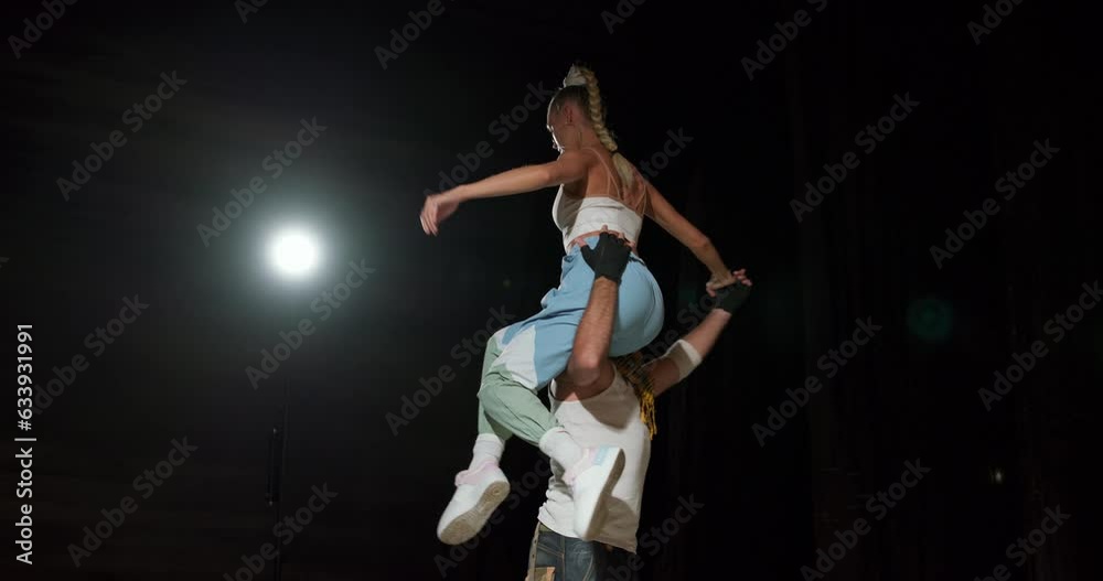 hip-hop dancers woman and man performing different tricks and movements ...