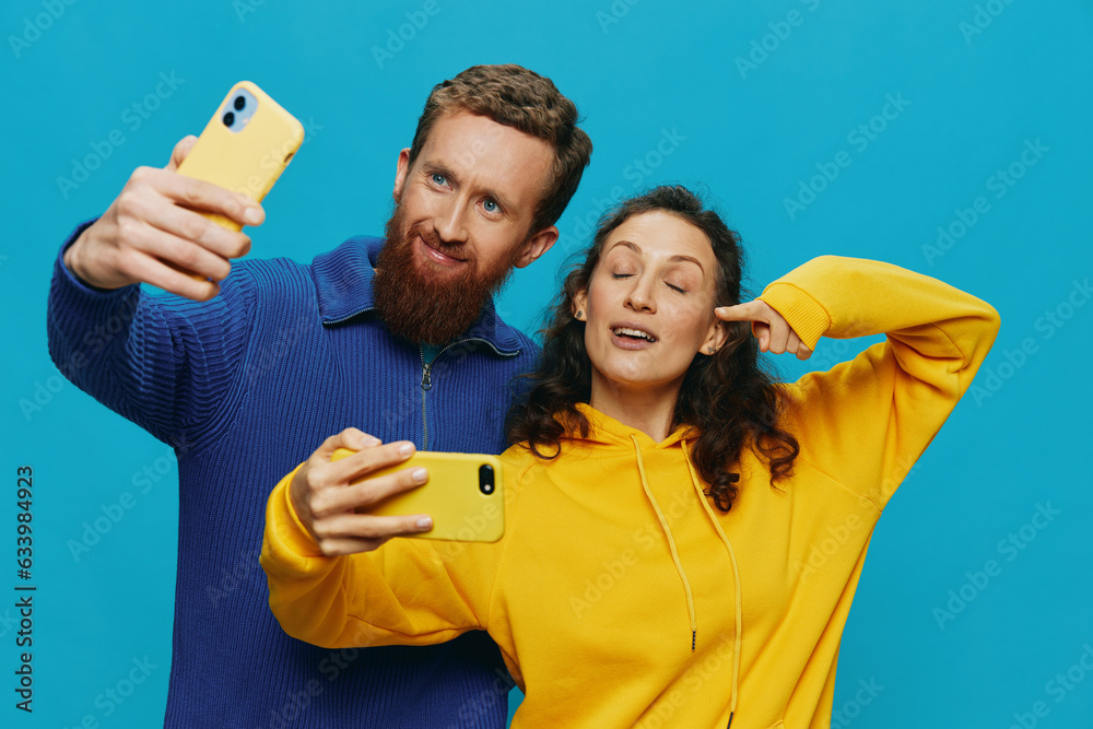 Woman and man funny couple with phones in hand taking selfies crooked ...