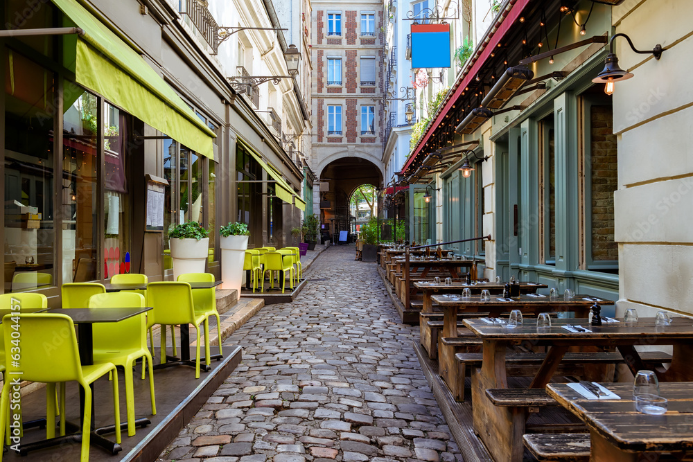 Cozy street near Boulevard San-German with tables of cafe in Paris ...