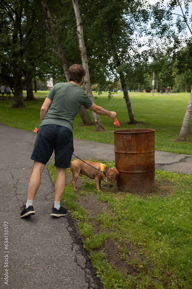 Photo of a caucasian middle aged man walking his cocker spaniel dog and ...