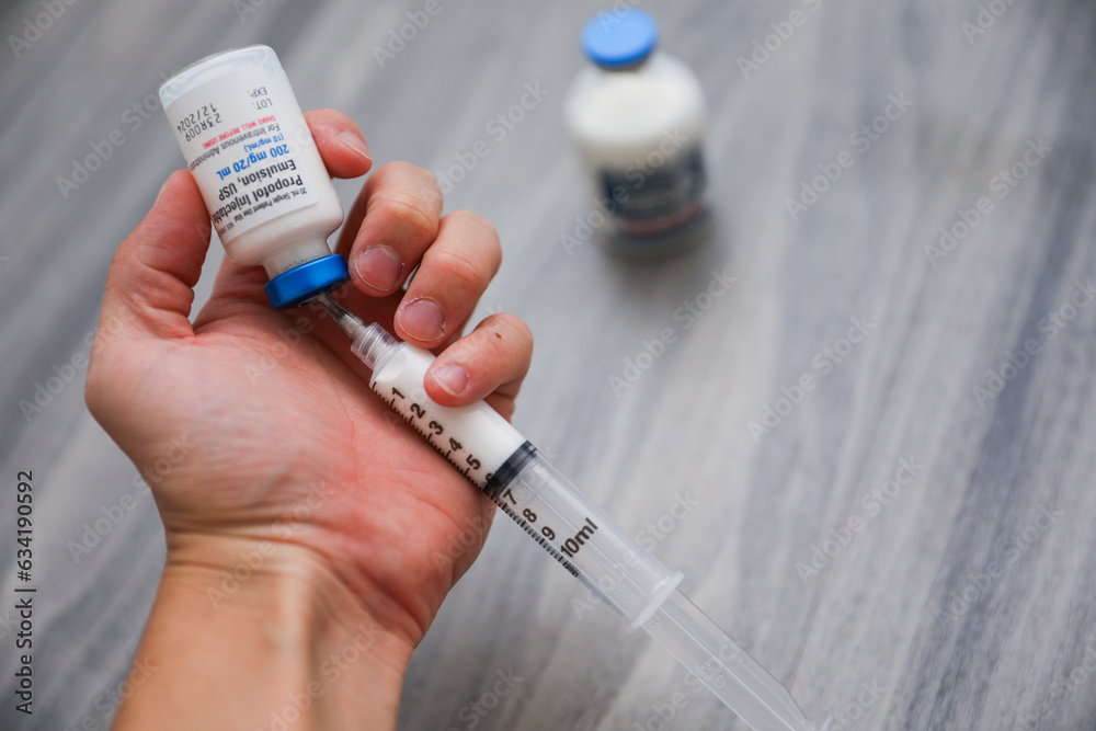 Chicago, IL, USA, Aug 12, 2023, propofol beside a shattered clock ...