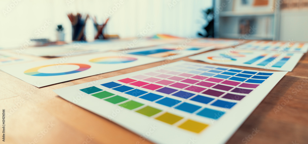 Panorama shot of various color palette idea papers arranged neatly on ...