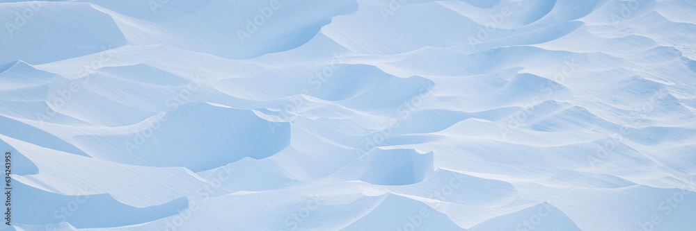 Snow texture. Wind sculpted patterns on snow surface. Wind in the ...