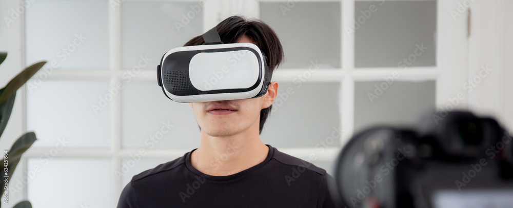 Young asian man wearing vr headset while workout and exercise with live ...