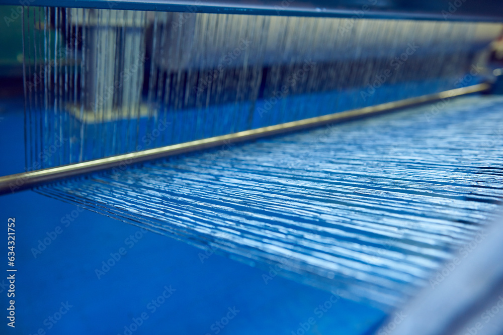 Cotton threads in industrial cotton in a weaving factory, machine ...